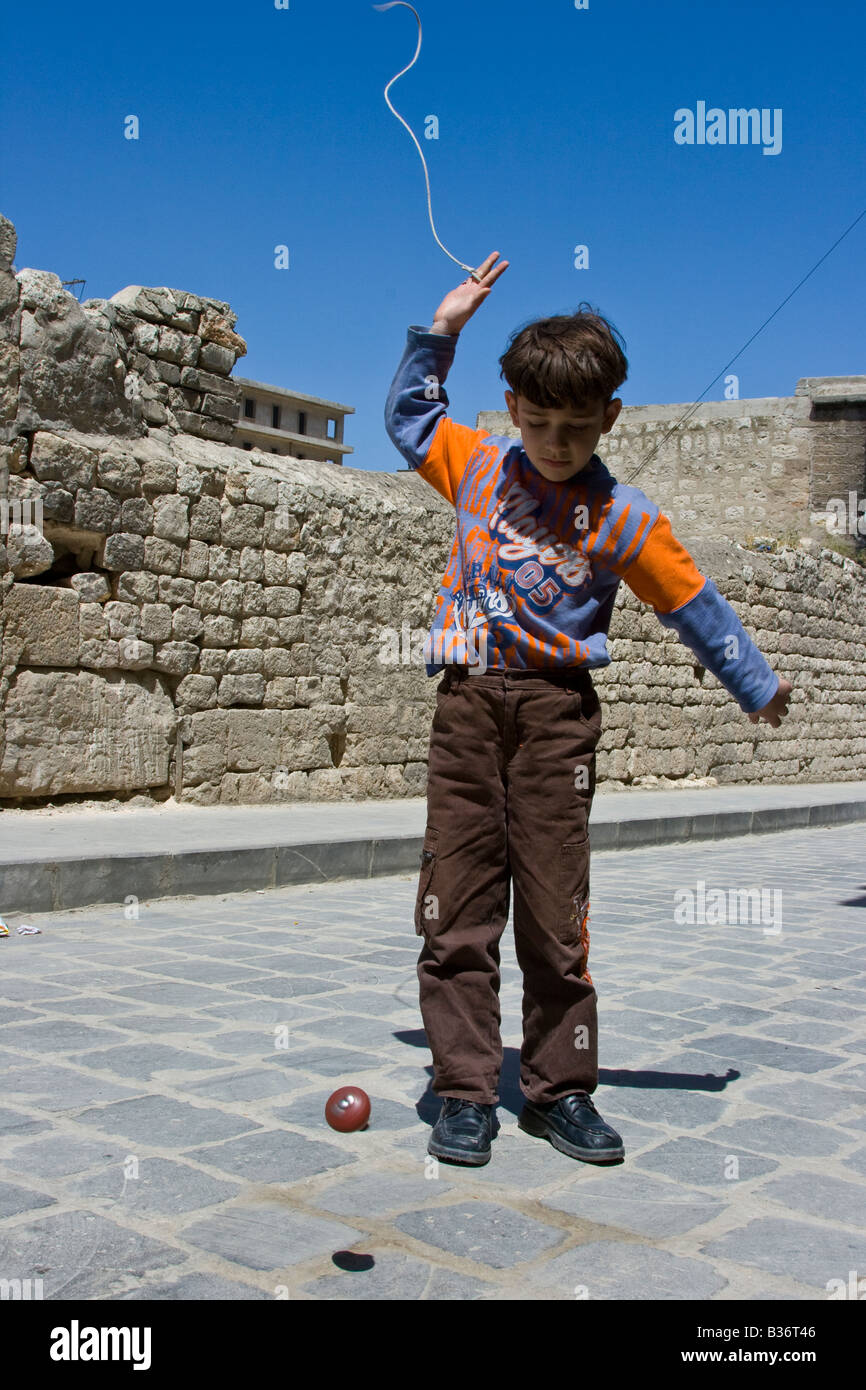 Boy playing spinning top hi-res stock photography and images - Alamy