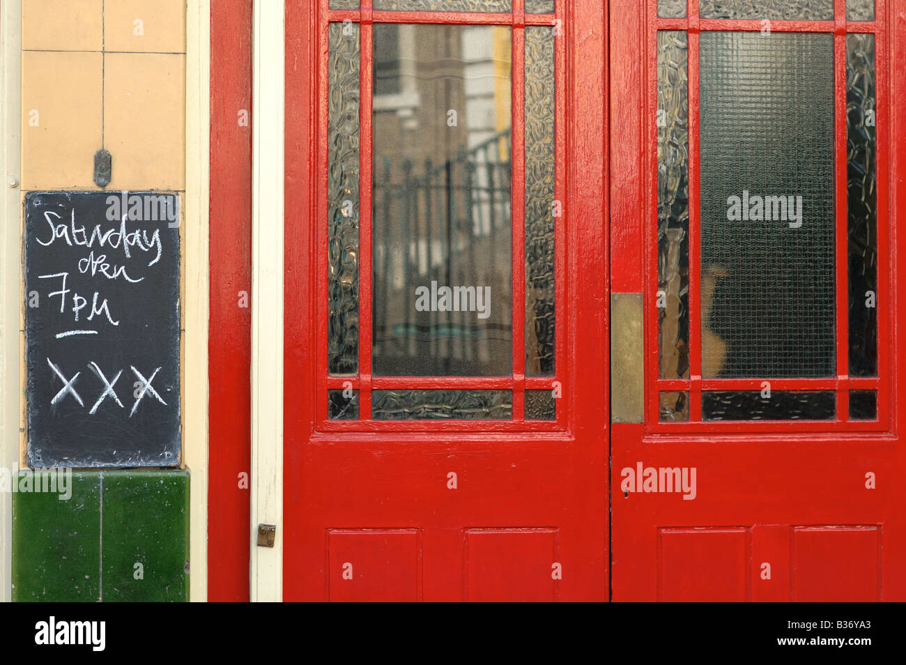 Wood and glass doors with blackboard at the Kings Of Clerkenwell Pub ...