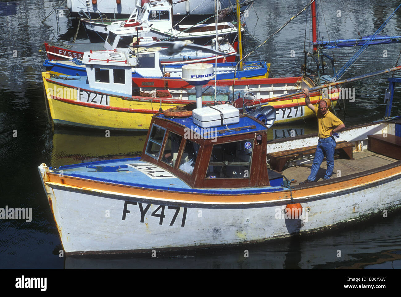 Fishing boats in Polperro harbour, Cornwall UK Stock Photo - Alamy