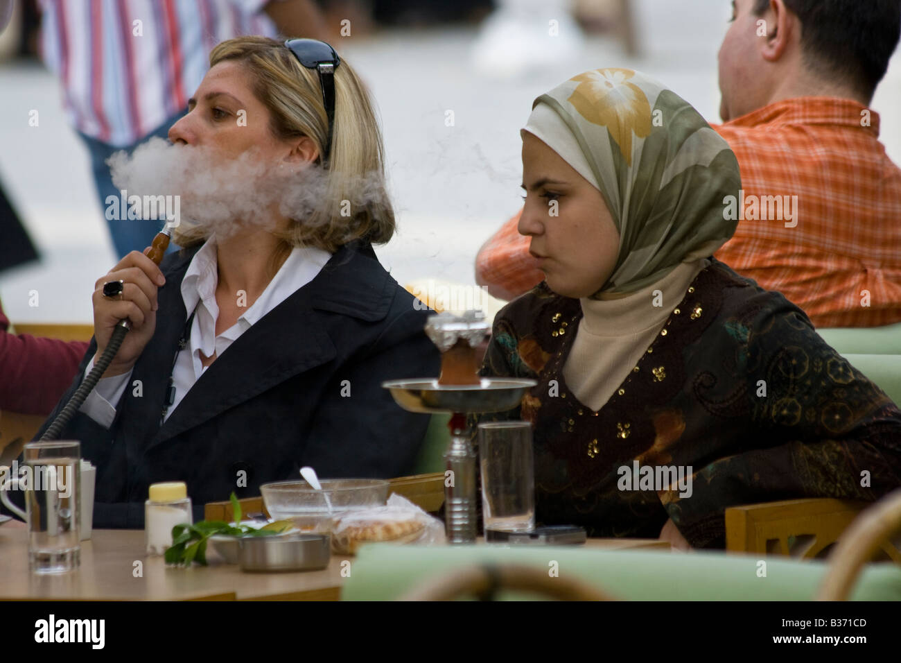 Woman smoking hookah hi-res stock photography and images - Alamy