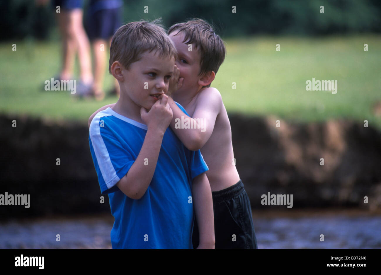 Two boys whispering hi-res stock photography and images - Alamy