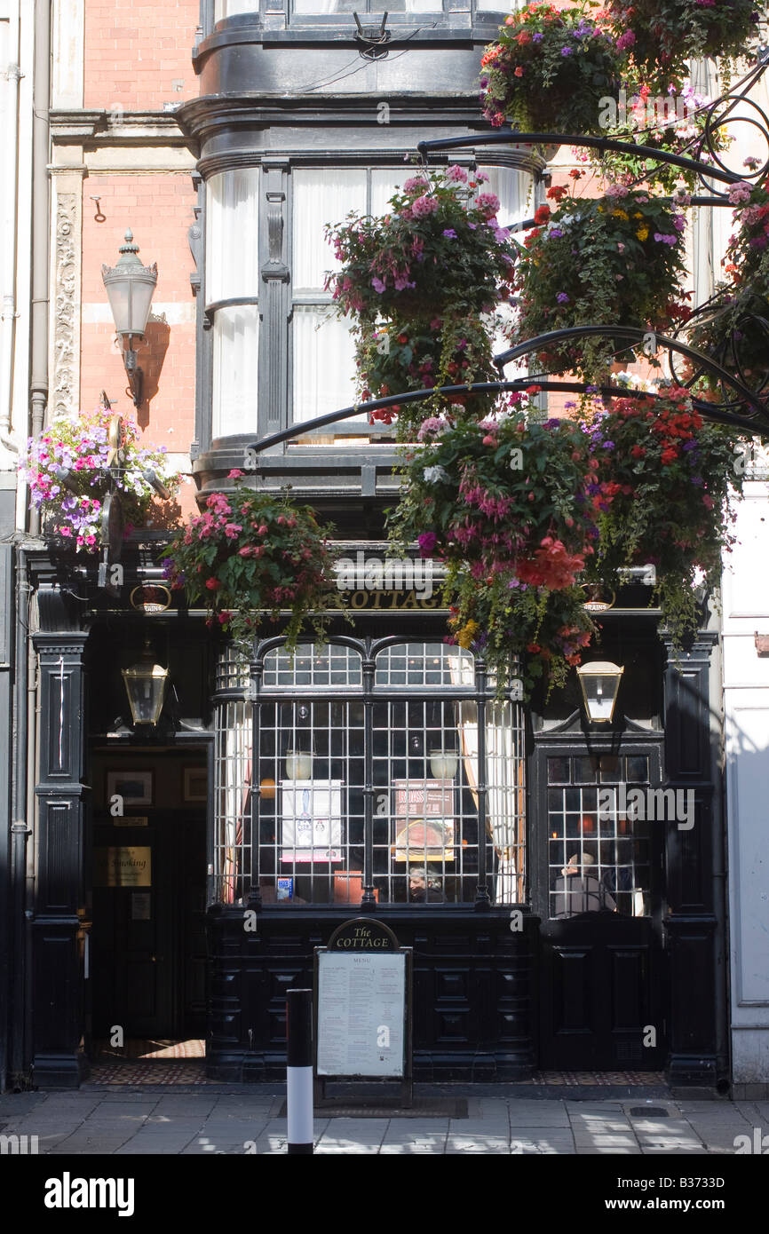 Flower baskets outside the Cottage pub St Mary Street Cardiff Stock ...