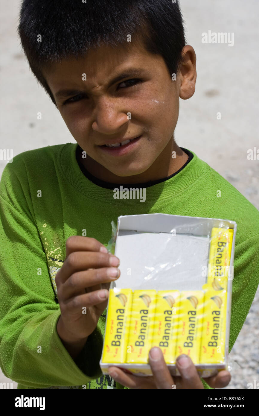 Poor Iranian Boy Selling Gum at the Ruins of Persepolis, Iran Stock ...