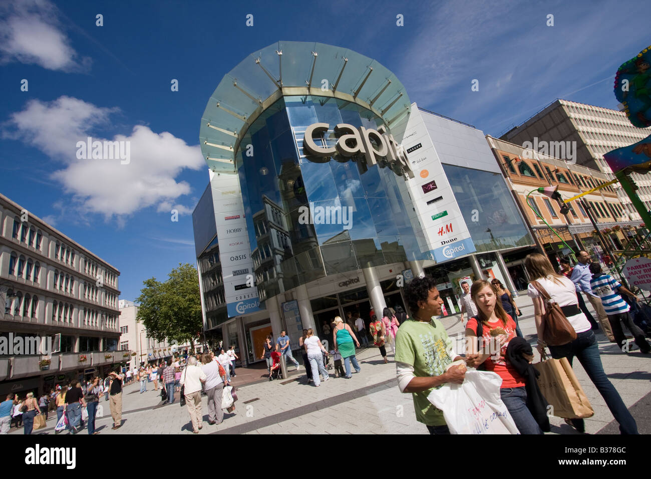Shoppers walking outside the Capitol Centre Queen Street Cardiff Stock ...