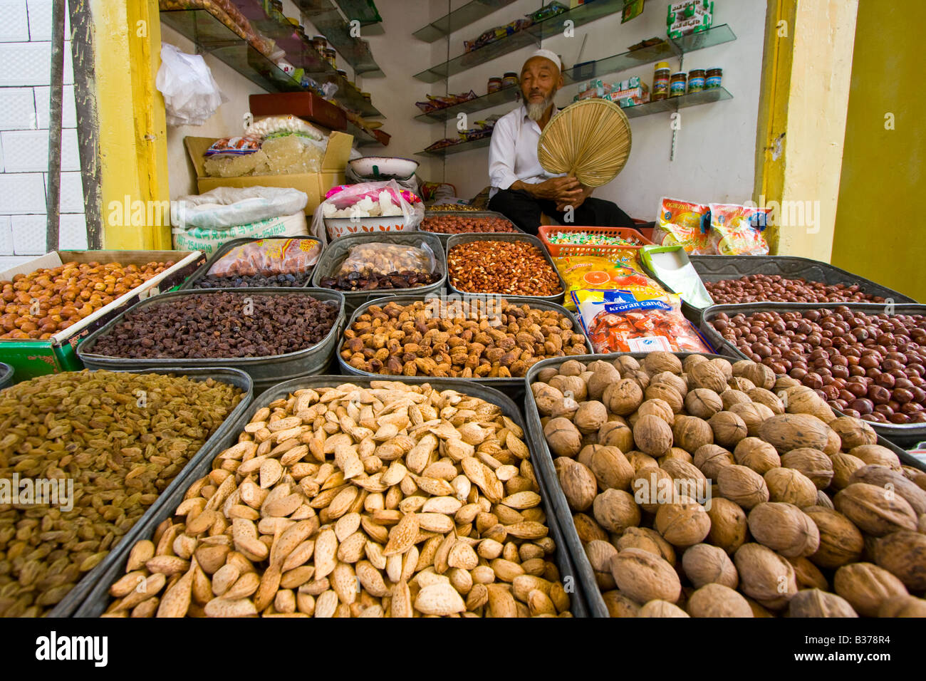 Uyghur Man Selling Nuts in Kashgar in Xinjiang Province China Stock ...