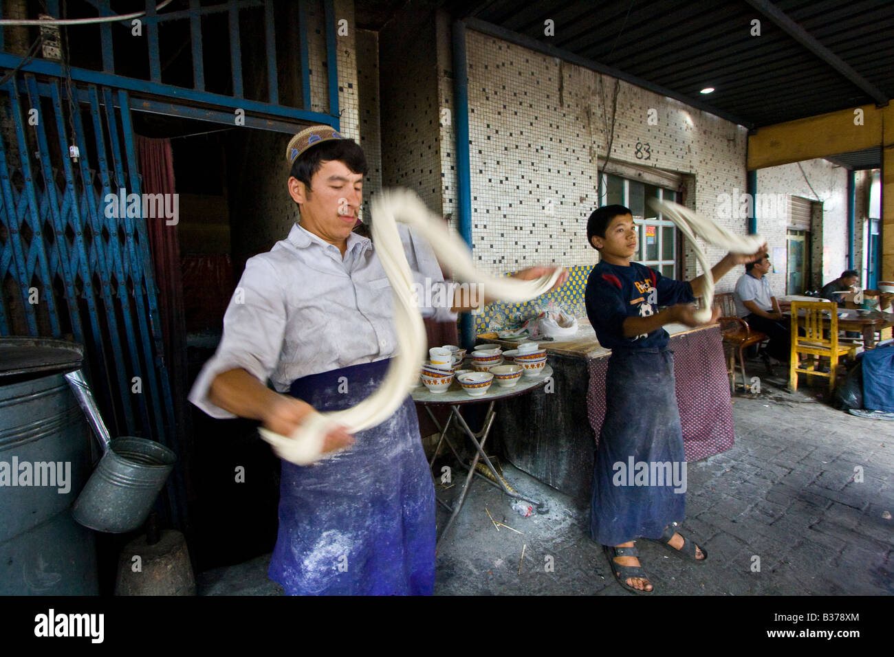 Uyghur Man Making Fresh Laghman Noodles at the Sunday Market in Kashgar ...