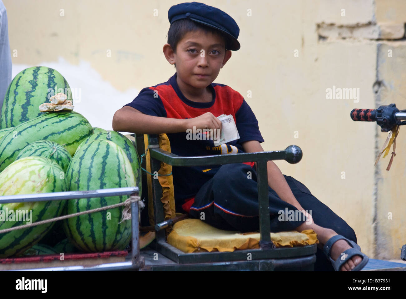 Uyghur Boy Selling Watermelons in Kashagar in Xinjiang Province in ...