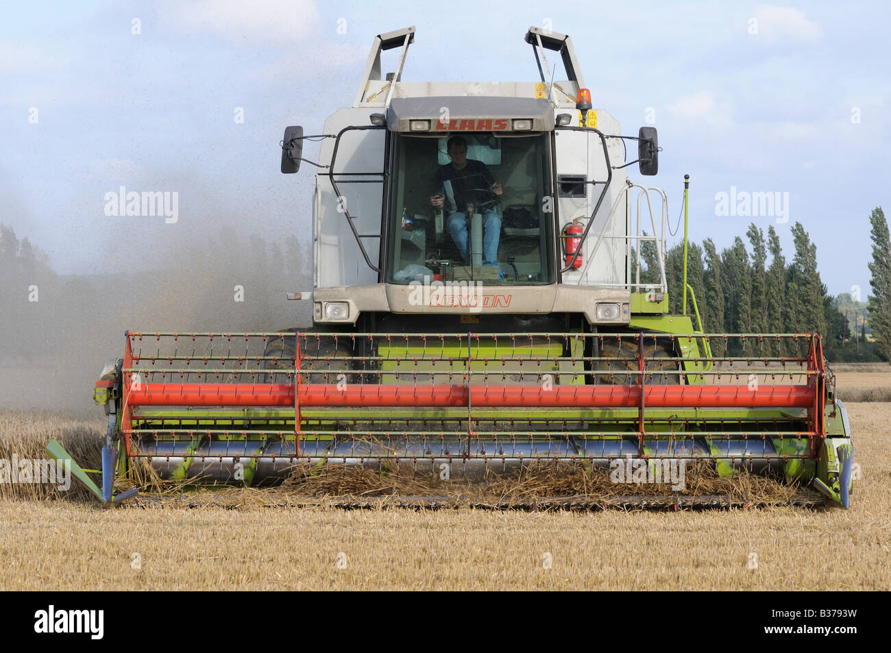 Claas Lexion 450 Combine Harvester cutting wheat in kent england Stock ...