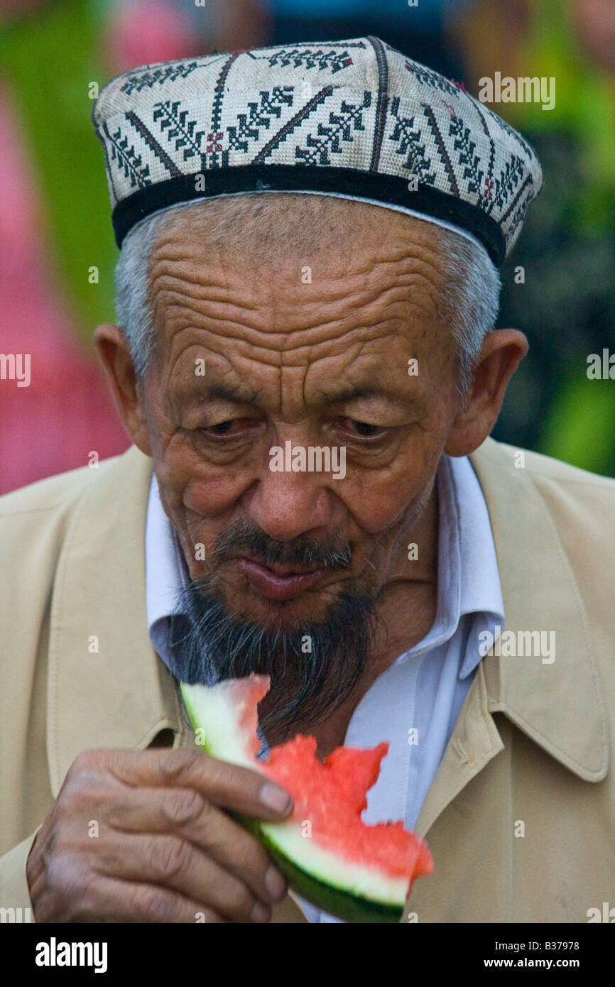Elderly Uyghur Man Eating Watermelon in Old Kashgar in Xinjiang ...