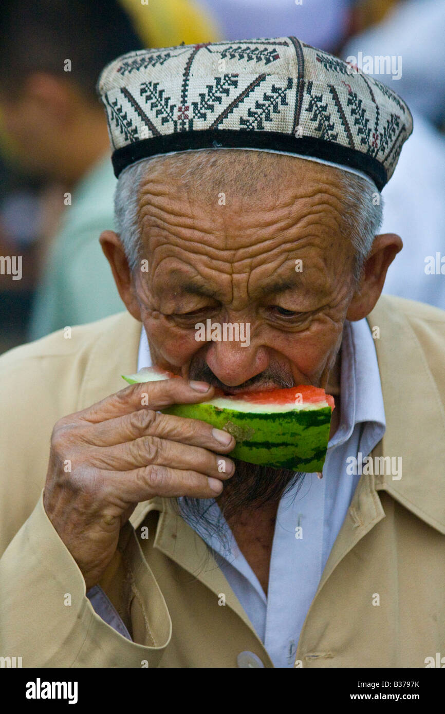 Elderly Uyghur Man Eating Watermelon in Old Kashgar in Xinjiang ...