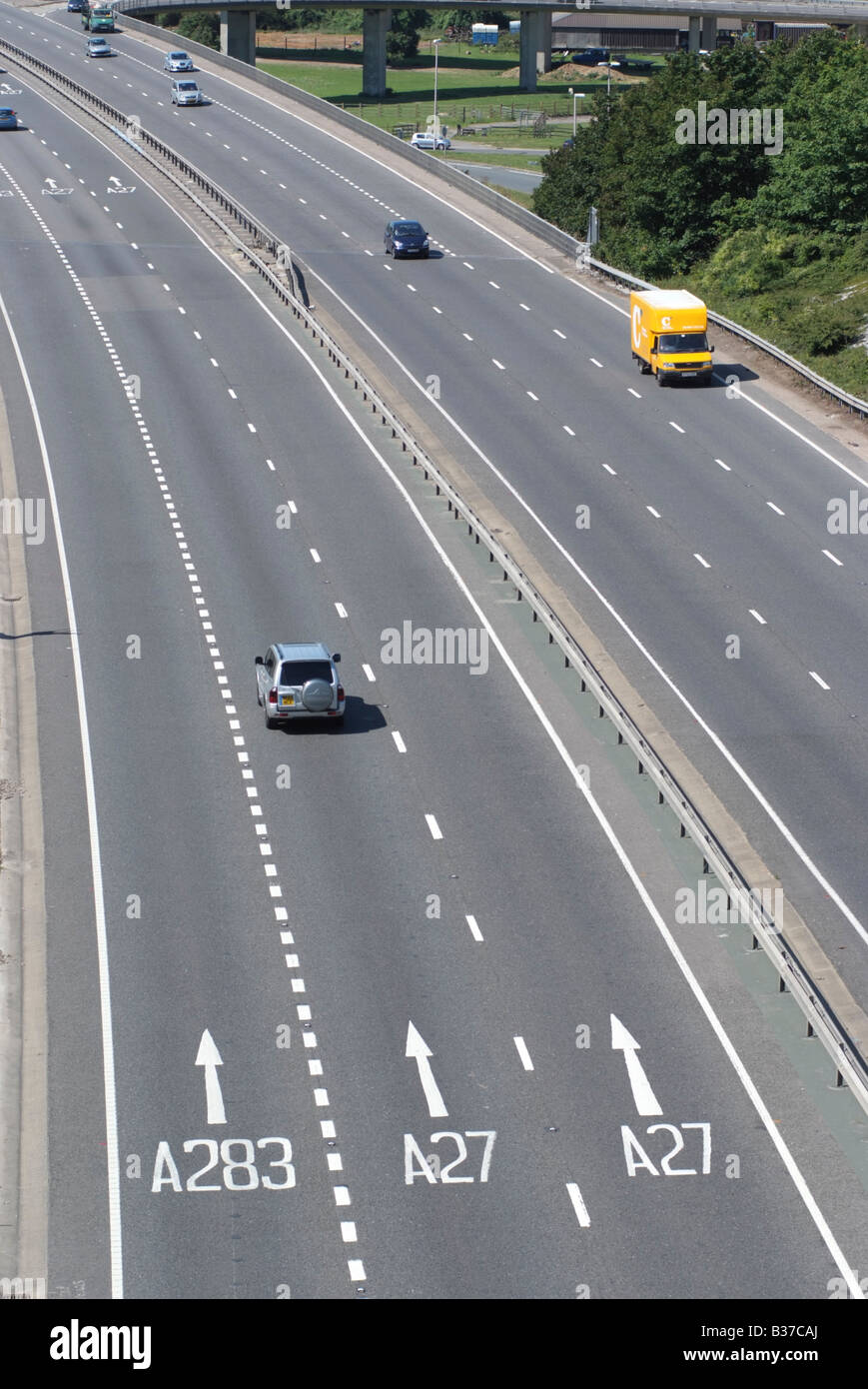 Traffic driving on a dual carriageway road A27 highway in West Sussex ...