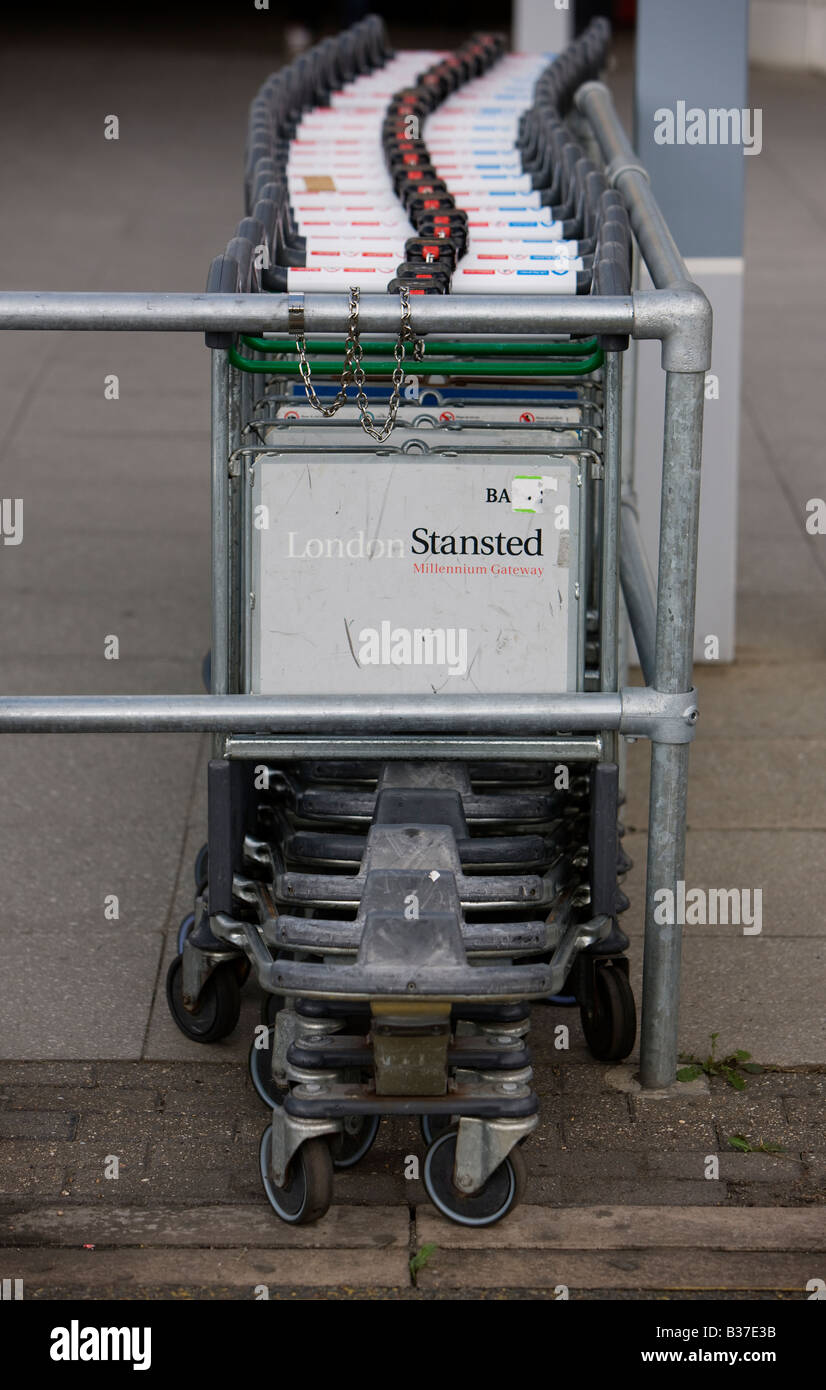 A line of Luggage trollies at London Stansted Airport in Essex UK ...