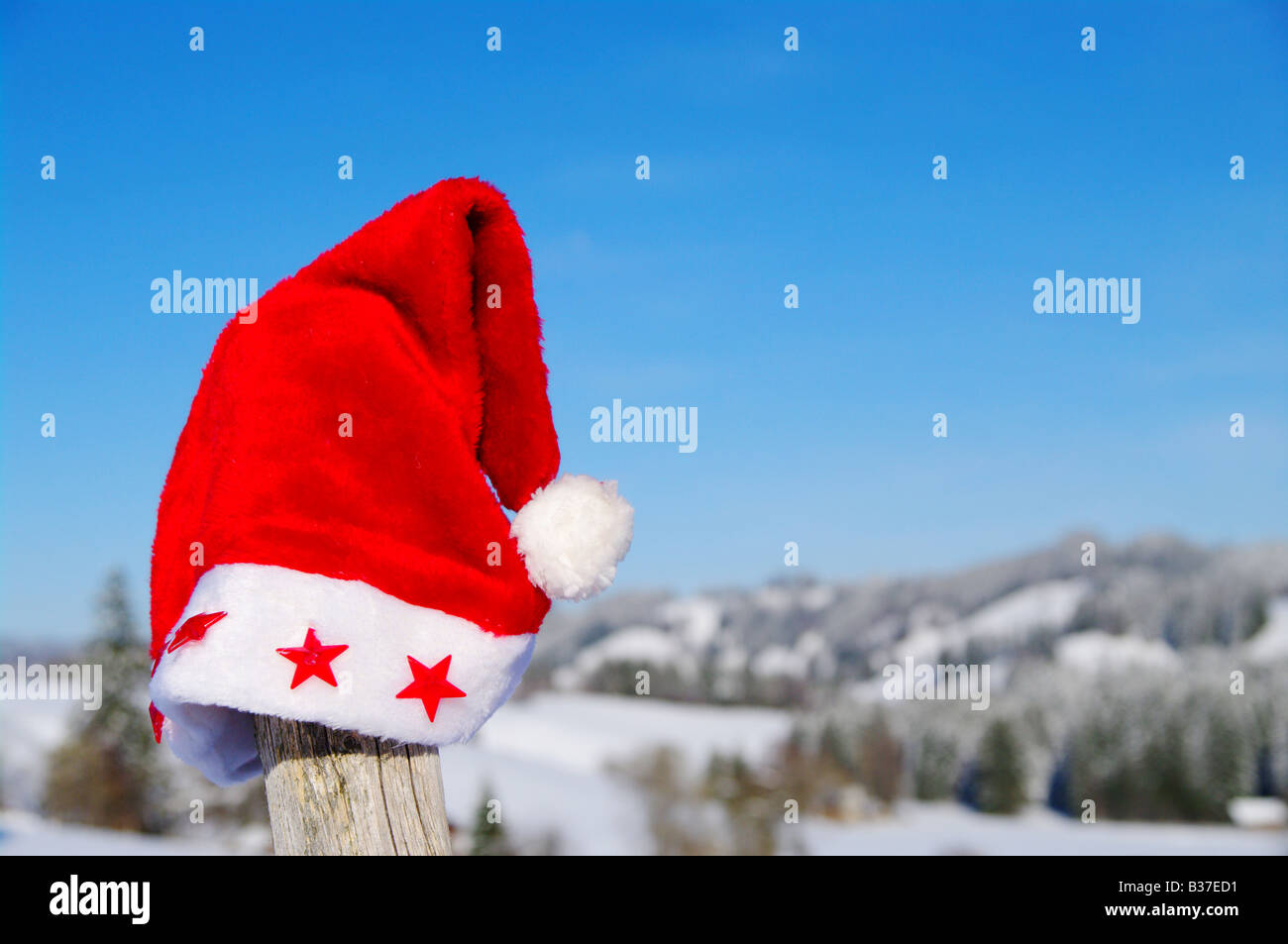 Santa Claus Christmas cap outside in a snowy landscape Stock Photo - Alamy