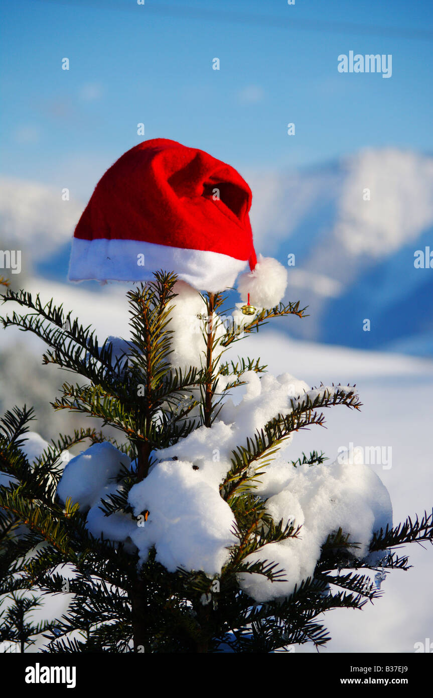 Santa Claus Christmas cap outside in a snowy landscape Stock Photo - Alamy