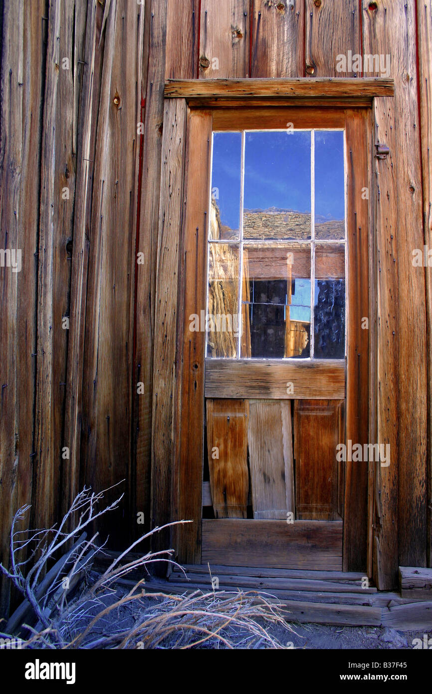 Old door of Bodie house reflects other Bodie buildings Stock Photo - Alamy