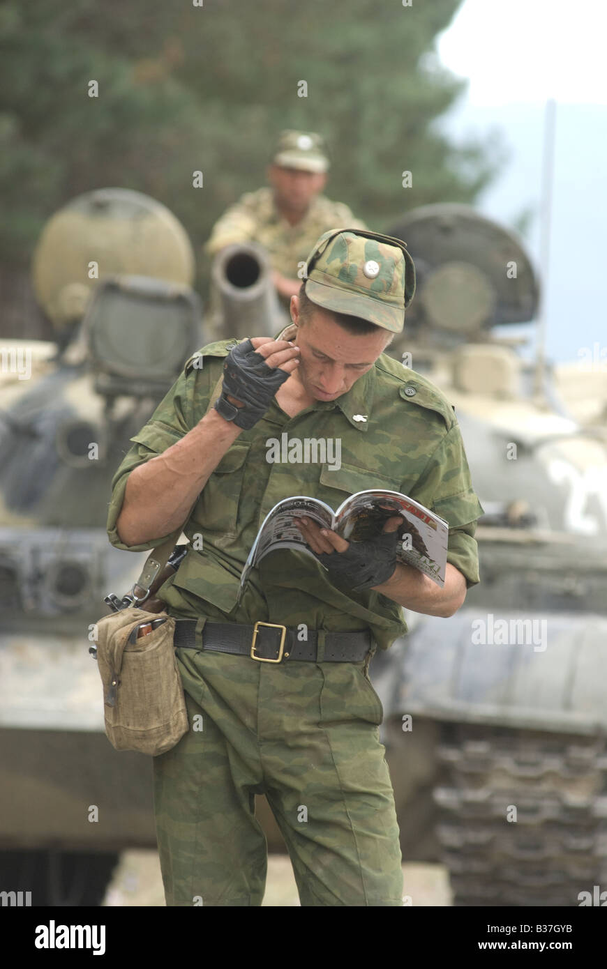 A Russian soldier reads a magazine near the city of Gori during the ...