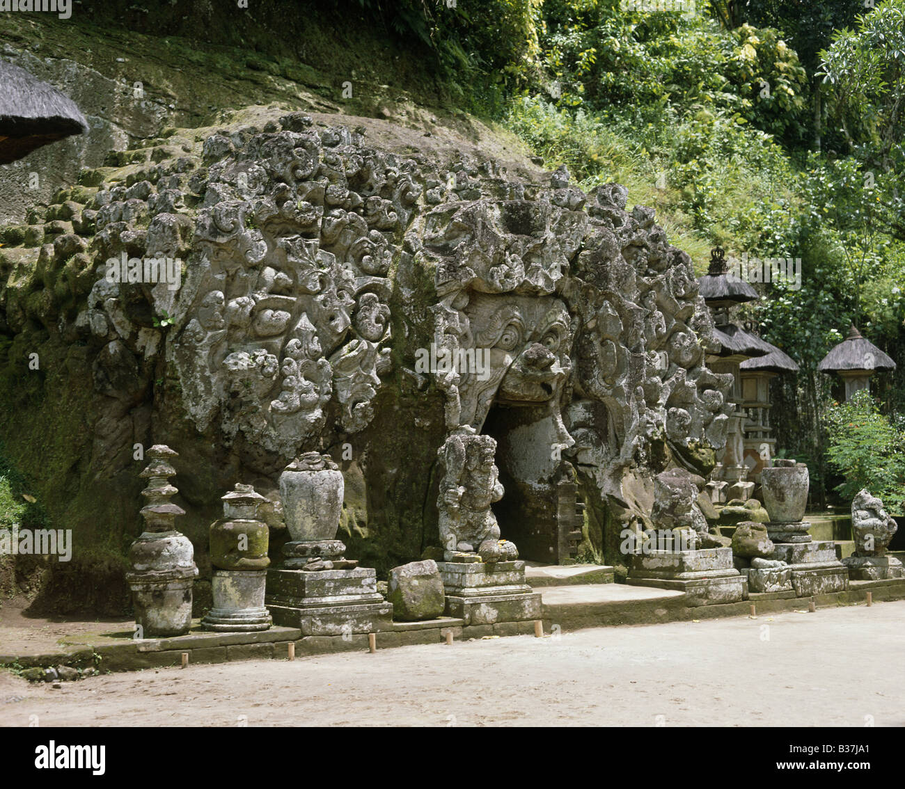 Elephant caves Hindu temple Carved rockface entrance Urns statues ...