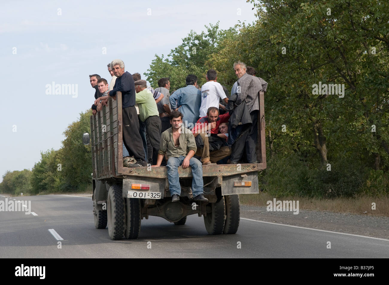 Villagers riding a truck in Georgia Stock Photo - Alamy