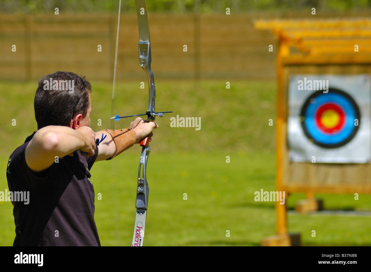 An archer at the instant the arrow leaves the bow Stock Photo - Alamy
