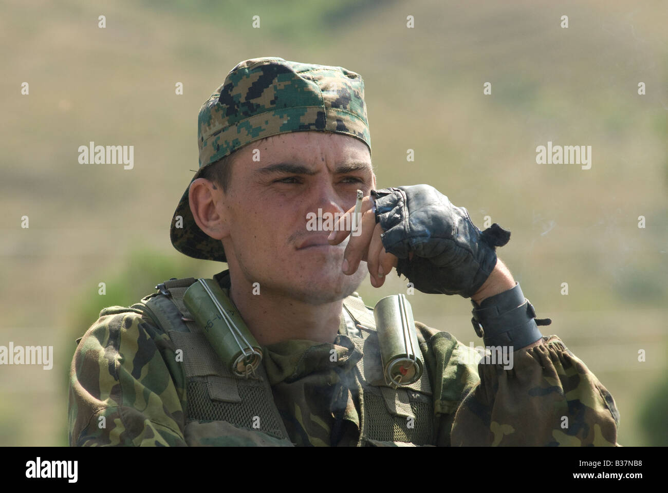 A Russian soldier smoking a cigarette during the Russo-Georgian War ...