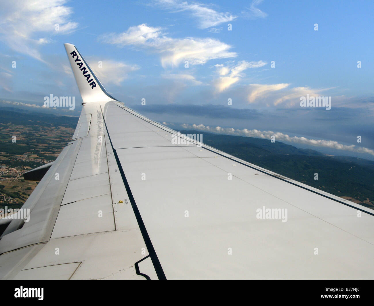 Ryanair Boeing 737-800 wing showing wing tip flying over land Stock ...