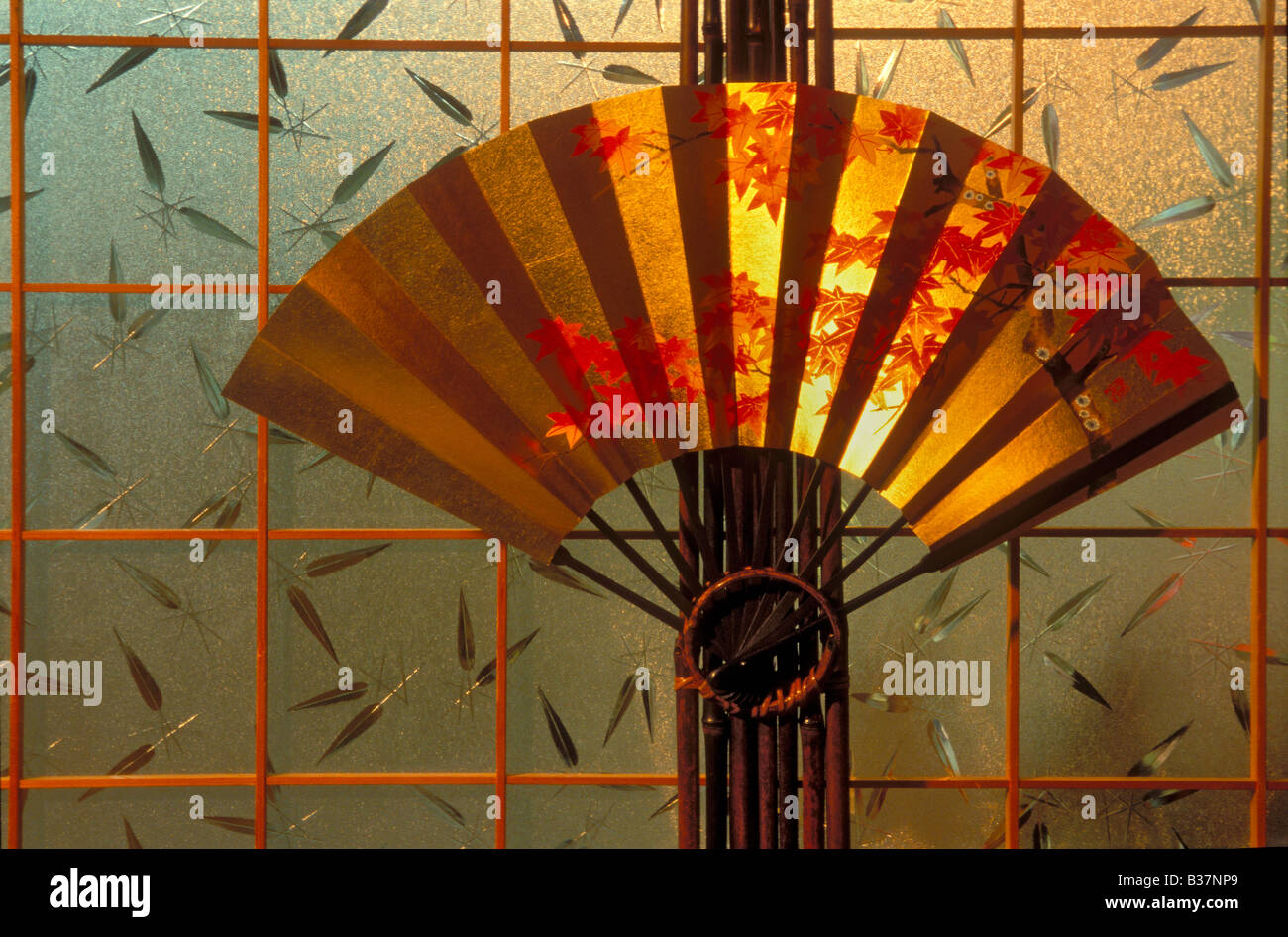 Hand made gold folding fan with autumn theme on display in Kyoto shop ...