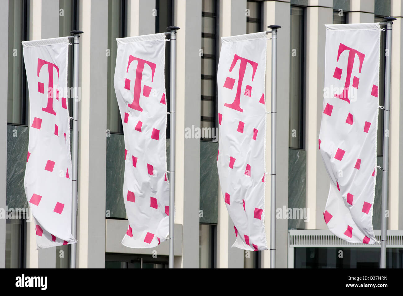 Flags with logos of Deutsche Telekom at Telekom headquarters, Bonn ...