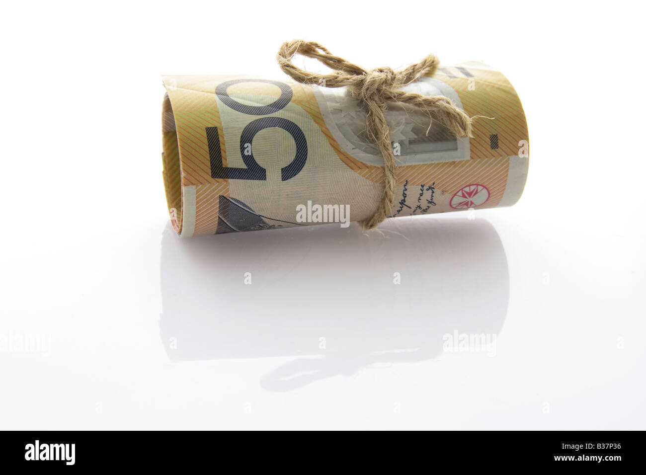 Roll of Dollar Notes Tied with String Stock Photo - Alamy