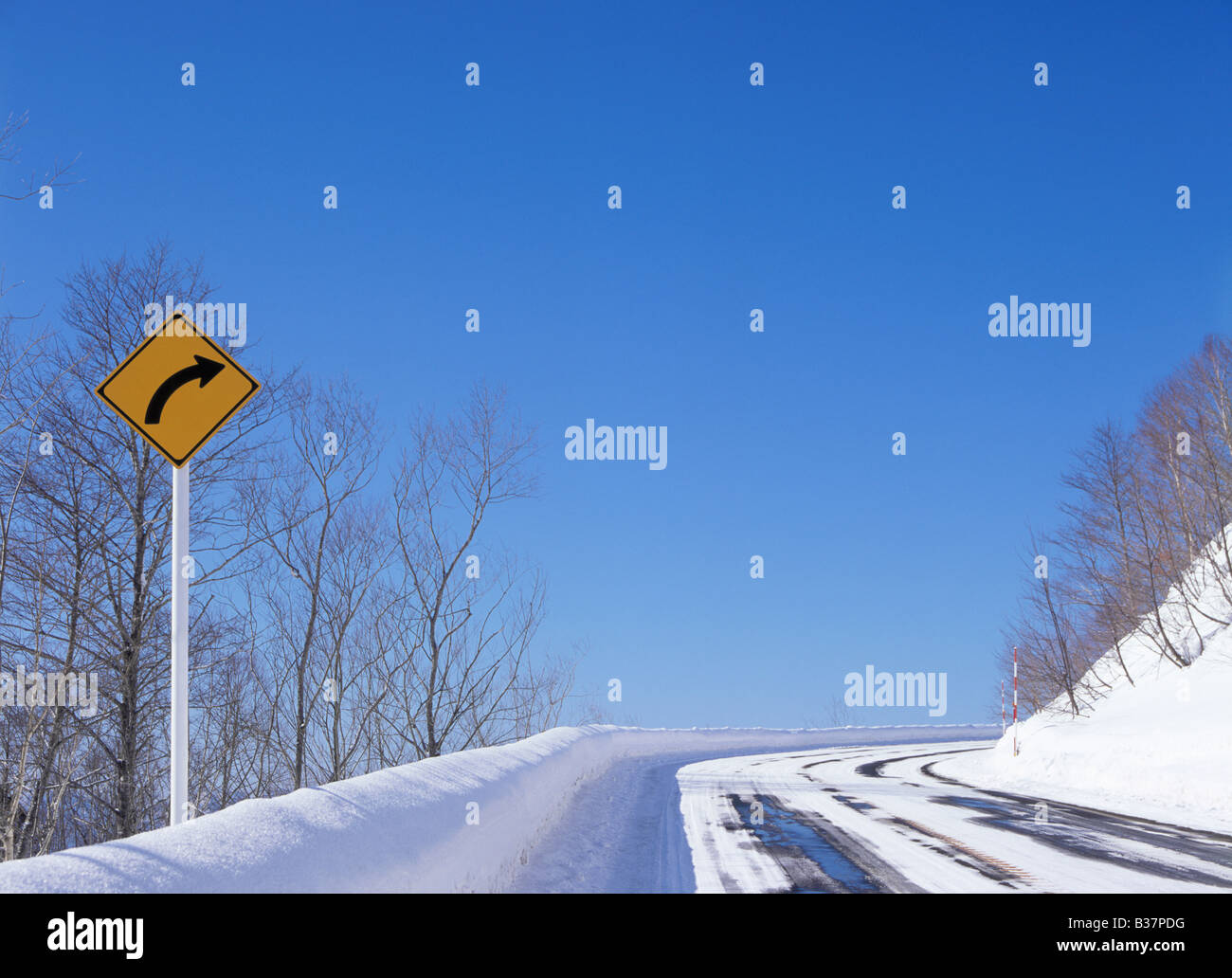 Yellow road sign winter hi-res stock photography and images - Alamy
