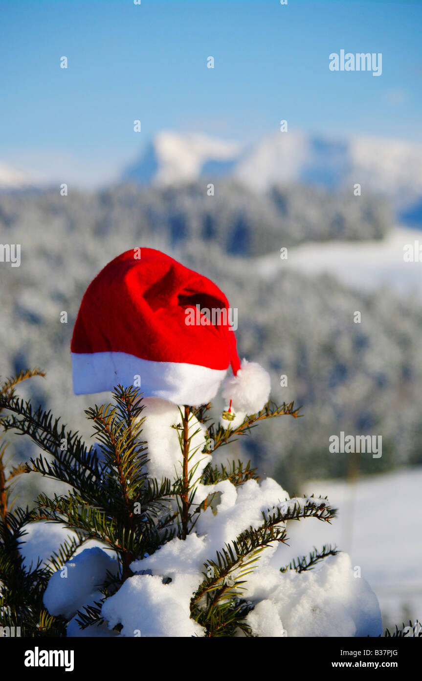 Santa Claus Christmas cap outside in a snowy landscape Stock Photo - Alamy