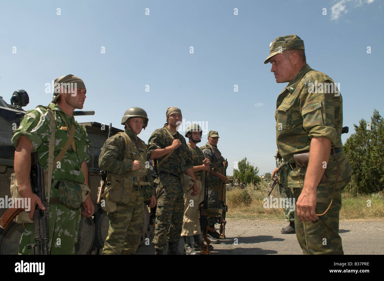 Russian troops receive instructions from their commander before ...