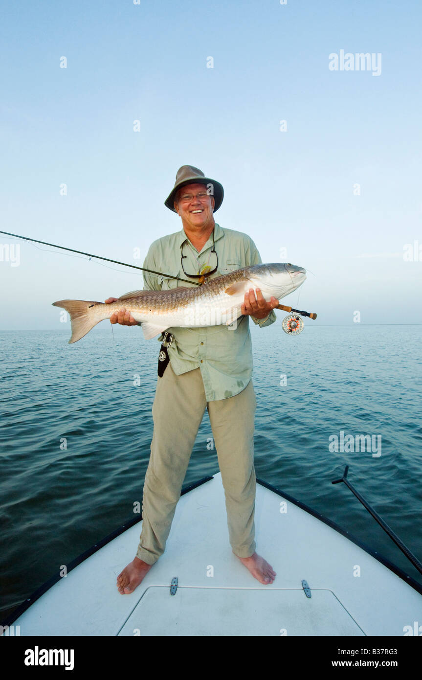 Fly fisherman shows his near record breaking Redfish caught in the ...