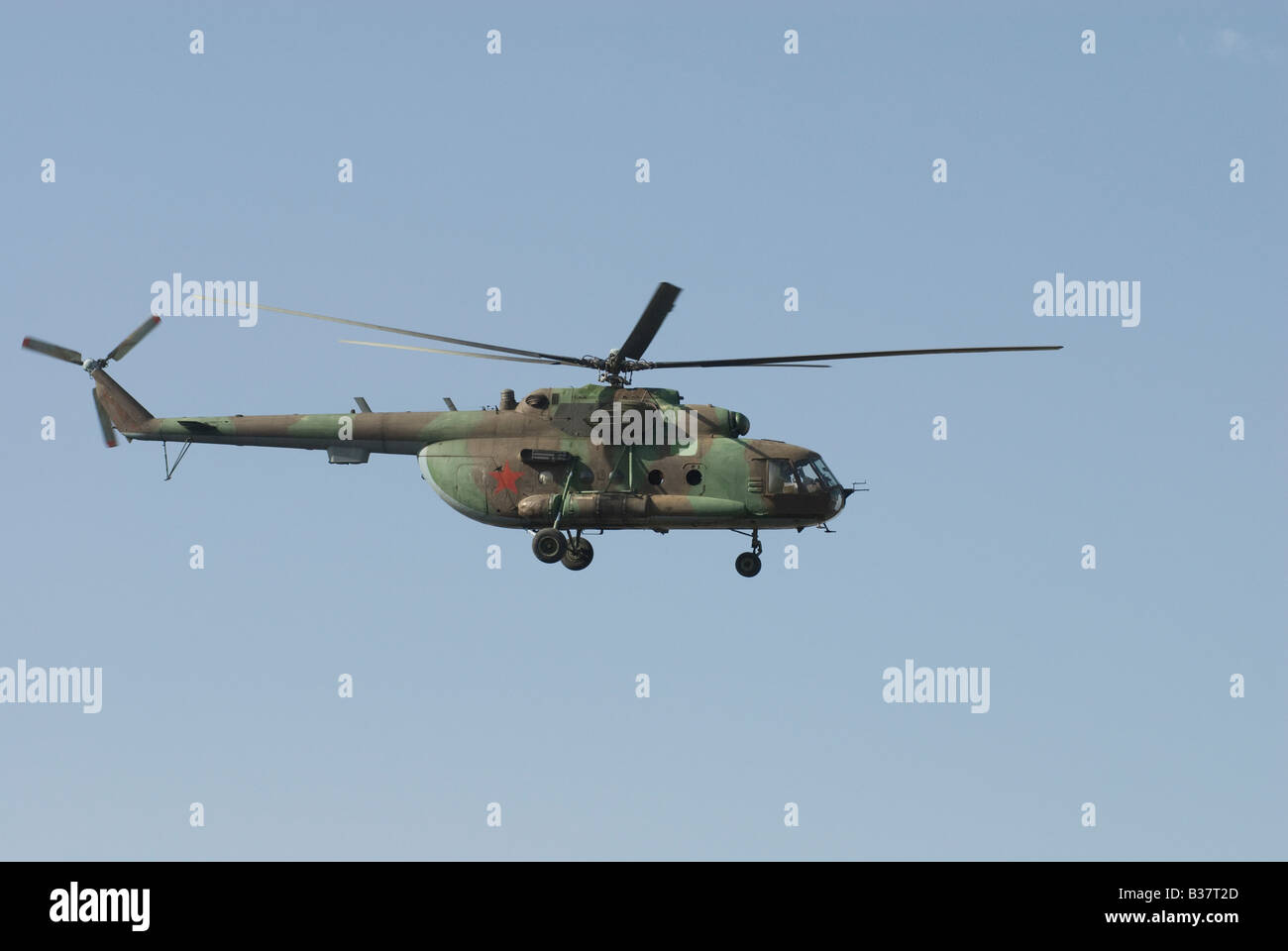 Mi-24 Hind Russian military helicopter flying in the sky Stock Photo ...