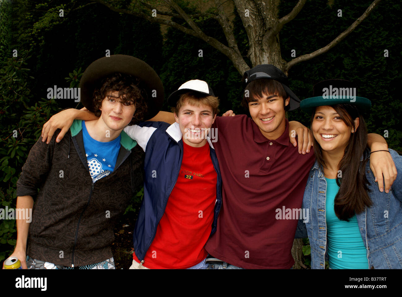 Four teenagers having fun Stock Photo - Alamy