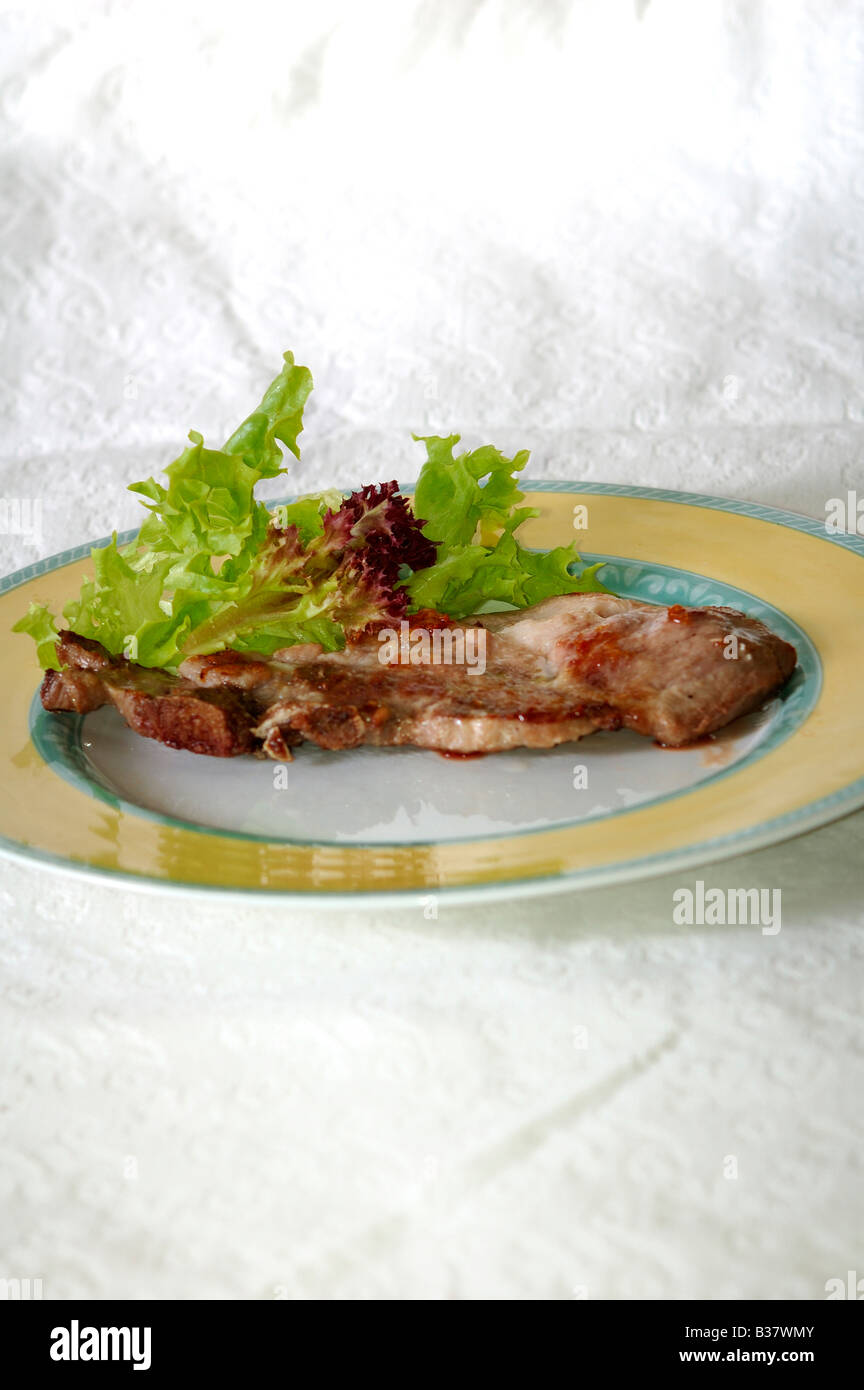 pork stake on white background Stock Photo - Alamy
