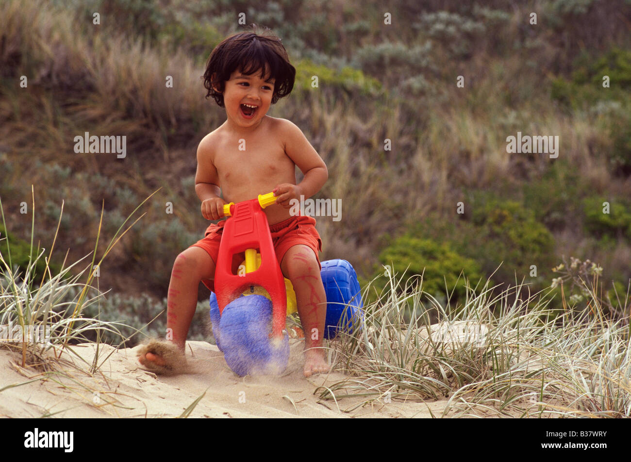 Child on the tricycle hi-res stock photography and images - Alamy