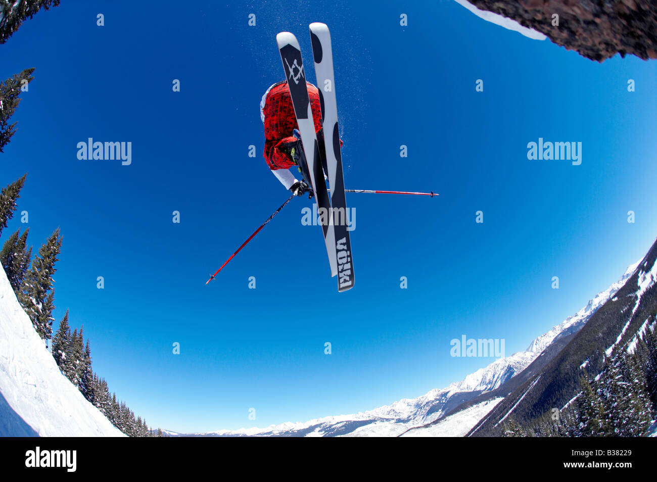 Skier jumping from overhead rock model release 507 Stock Photo - Alamy