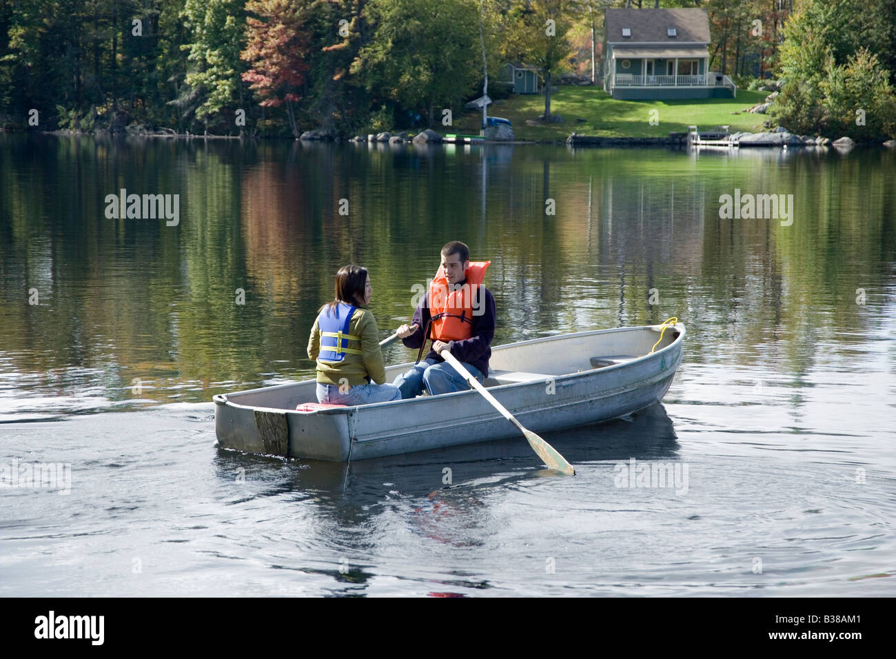 Couple boarding on boat Stock Photo - Alamy