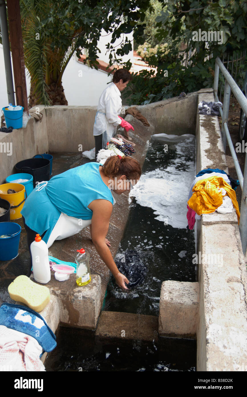 Woman washing clothes by hand hi-res stock photography and images - Alamy