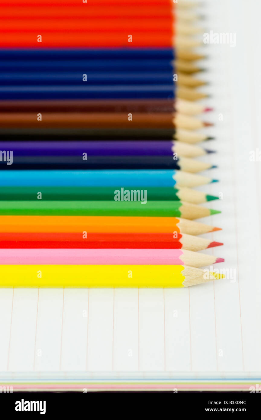 Coloured pencils on a lined A4 writing pad Stock Photo - Alamy