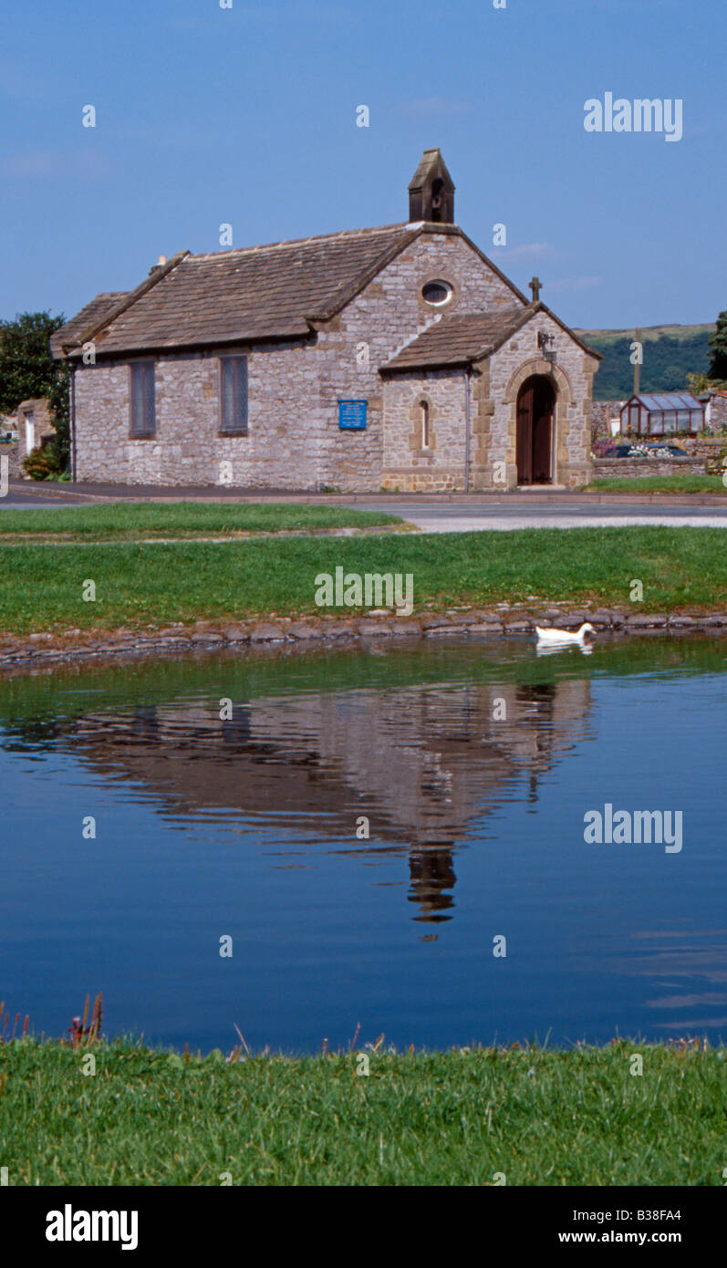 St Hugh's Church by village pond, Foolow, Derbyshire, UK Stock Photo ...