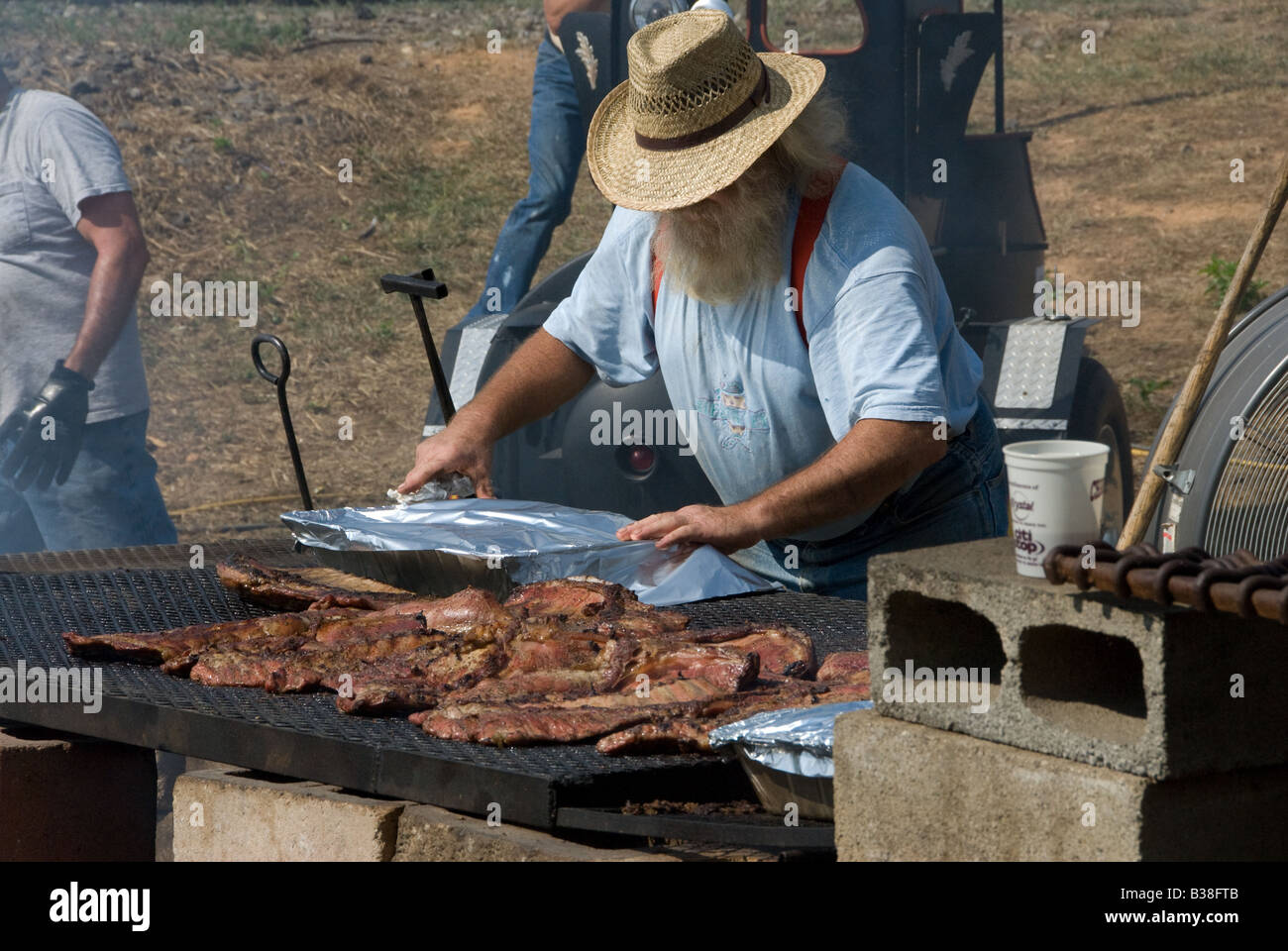 Man cooking ribs Stock Photo - Alamy