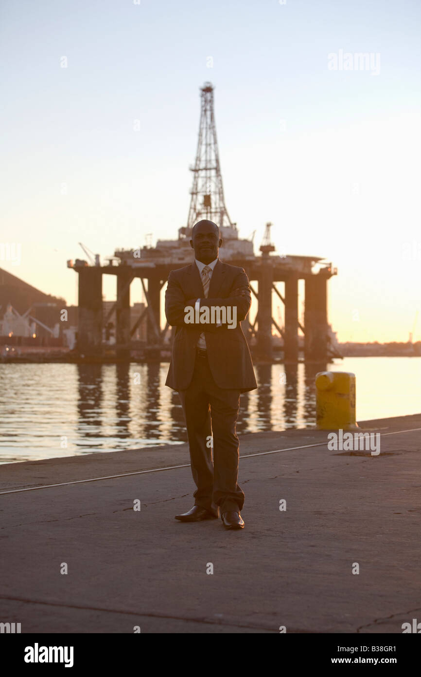 African American businessman on commercial pier Stock Photo - Alamy