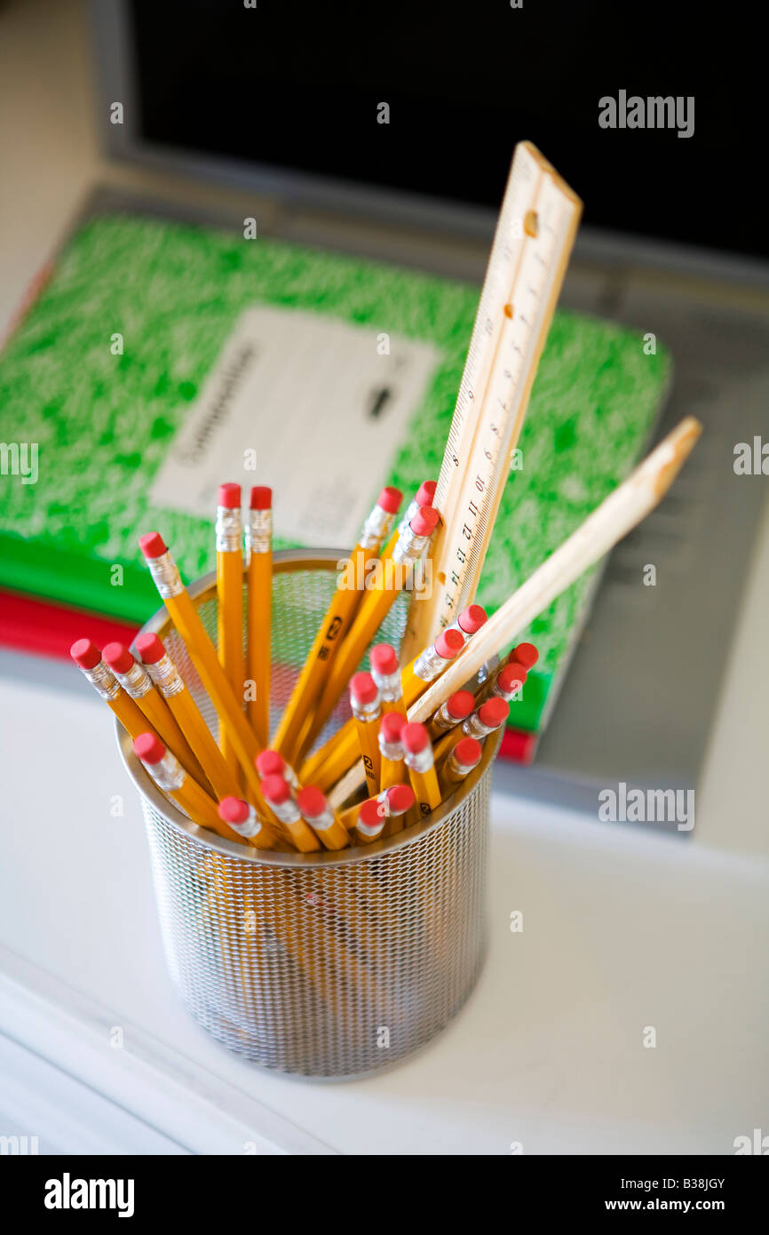 Full pencil container on desk Stock Photo - Alamy