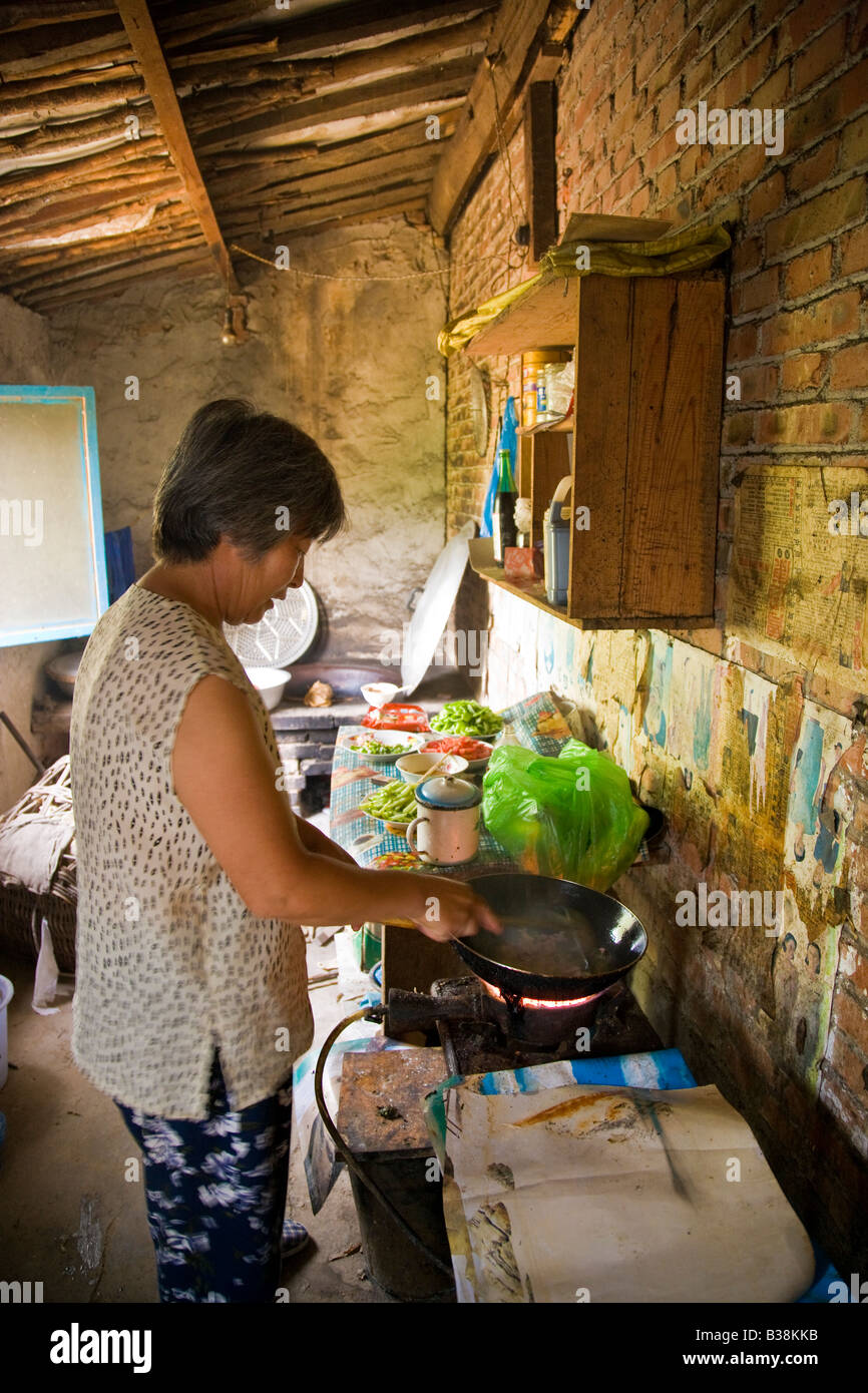 Modern peasant woman cooking in Datianzhuang village, Juyang County ...