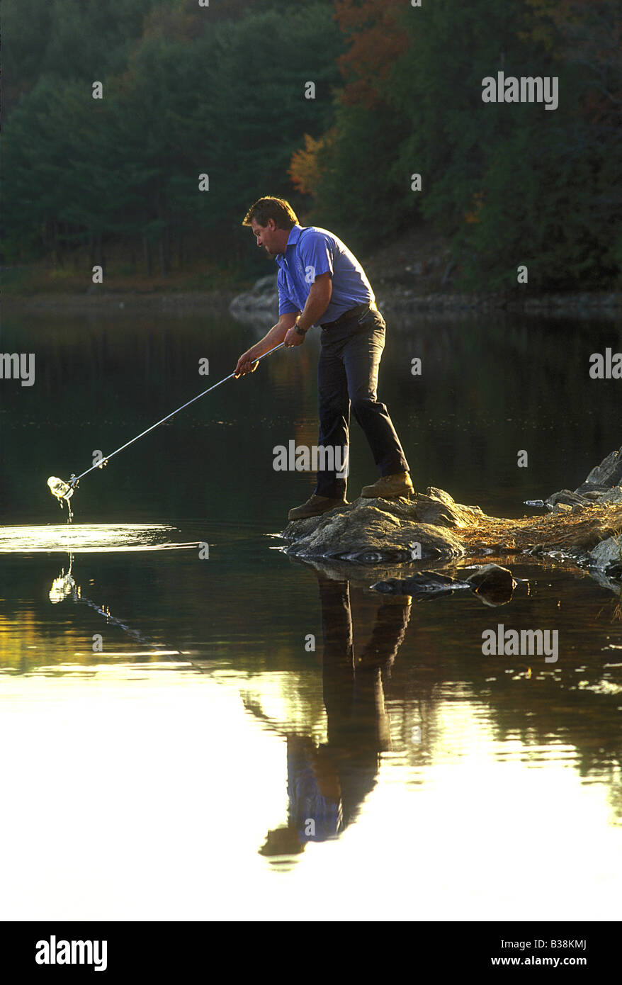 Man testing water in a river Stock Photo - Alamy