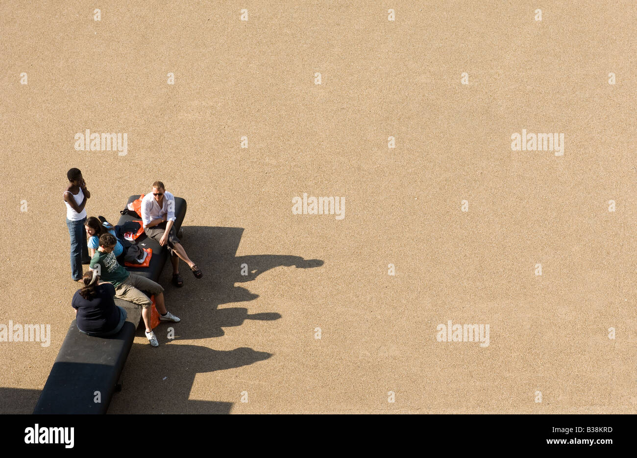 View from above of people relaxing in the sun outside the Tate modern ...