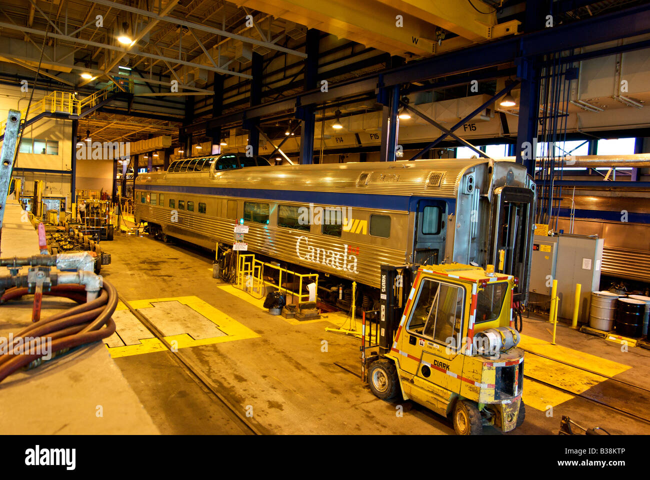 Dome car passenger train coach in maintenance shop awaiting cleaning ...