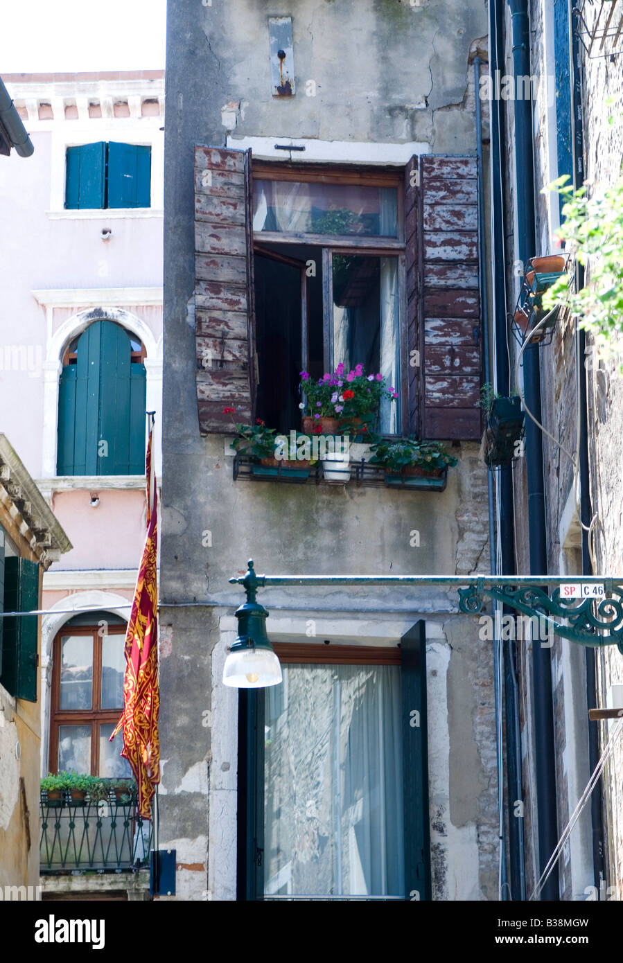 narrow street venice with window with shutters and street light Stock ...