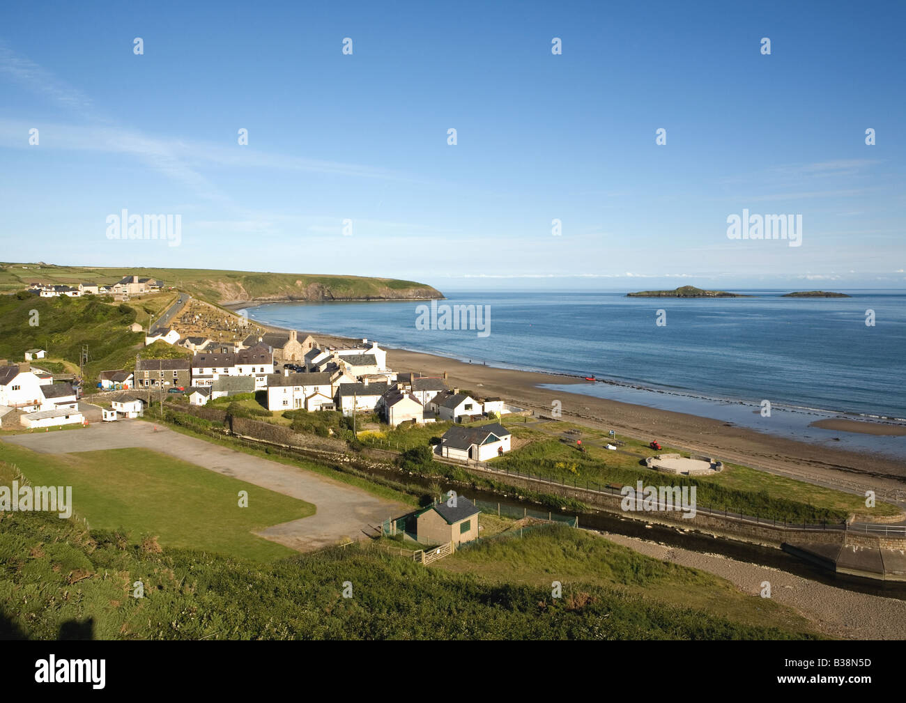 Early evening and the sun is setting over Aberdaron & Aberdaron Bay ...